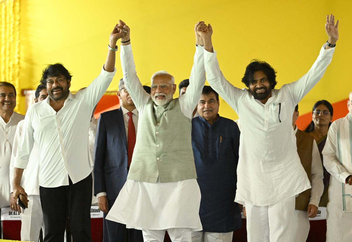 Chiru caresses brother Kalyan’s cheek, as Modi watches the siblings share the happy moments ...